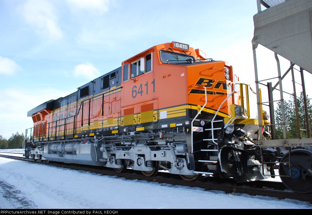 BNSF 6411 rear DPU on a west Grain train.